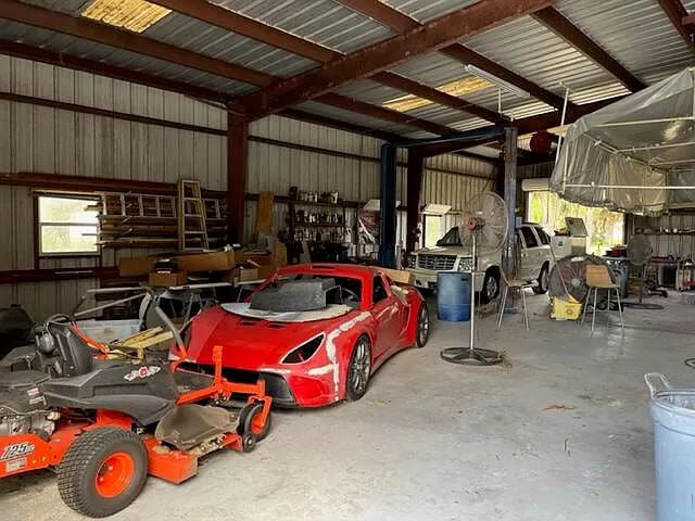 Anyone identify what kind of car the red one is? - 9GAG