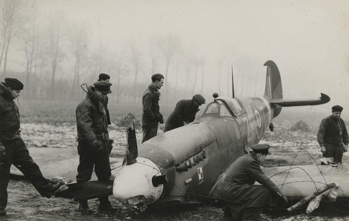 1 January 1945. A Supermarine Spitfire Mk IX of No. 303 'Polish' Squadron forced to land due to ...