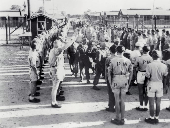 German prisoners of war line a funeral procession for one of their own ...