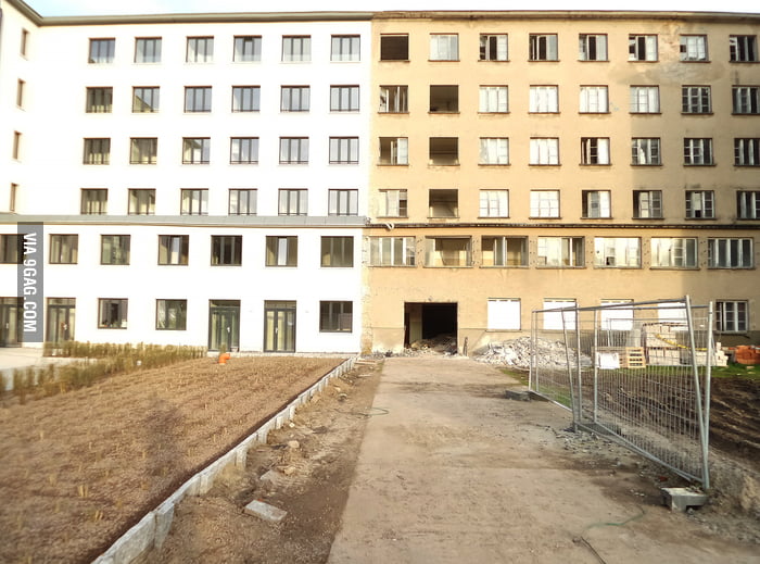 Building in North-Germany. One half: old ruins of a Nazi barrack. Other ...