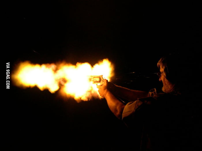 Muzzle flash and cylinder blast from a Smith & Wesson Model 500 fired ...