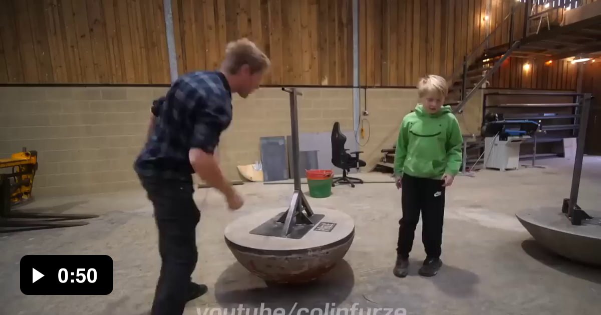 YouTuber, Colin Furze, bonding over human sized Weeble Wobles. - 9GAG