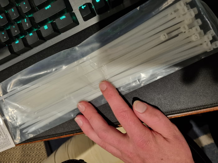 Open your cable ties in the centre. If you drop the packet they don't go everywhere - 9GAG