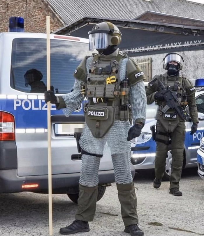 A German police officer wears a chain mail suit to deter knife attacks ...