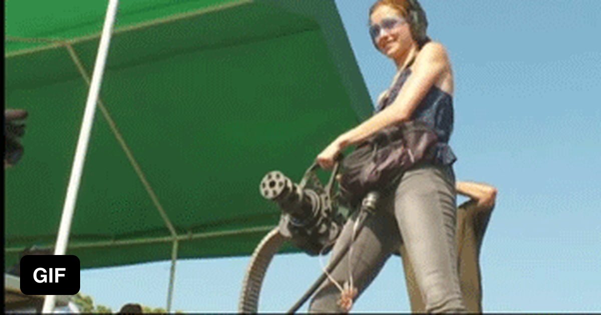 Firing an actual minigun from the hip - 9GAG