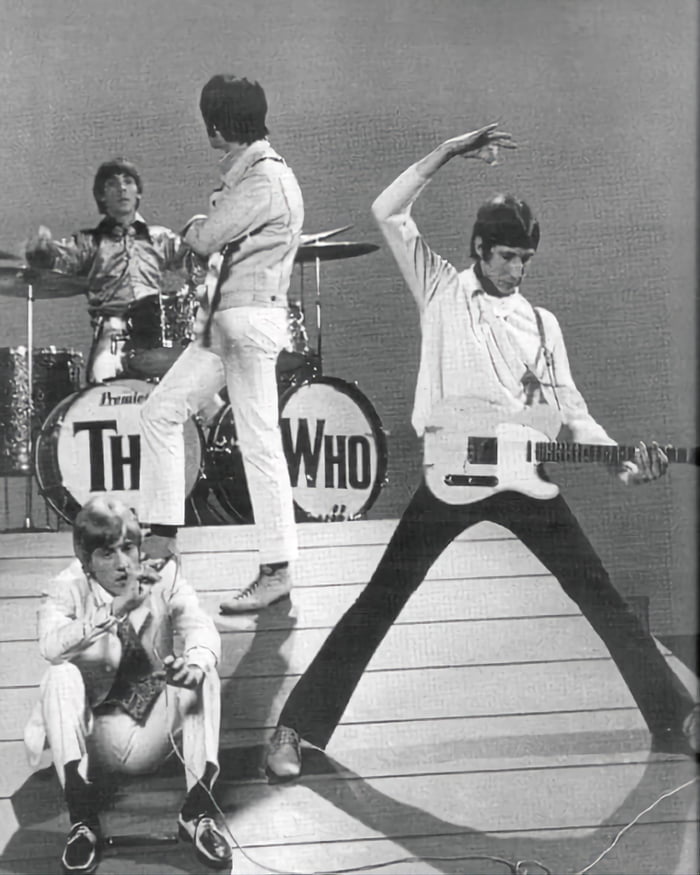 An iconic shot of The Who bringing the energy on stage - 9GAG