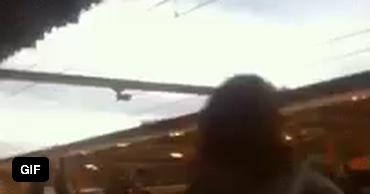 Two women fighting above train tracks - 9GAG