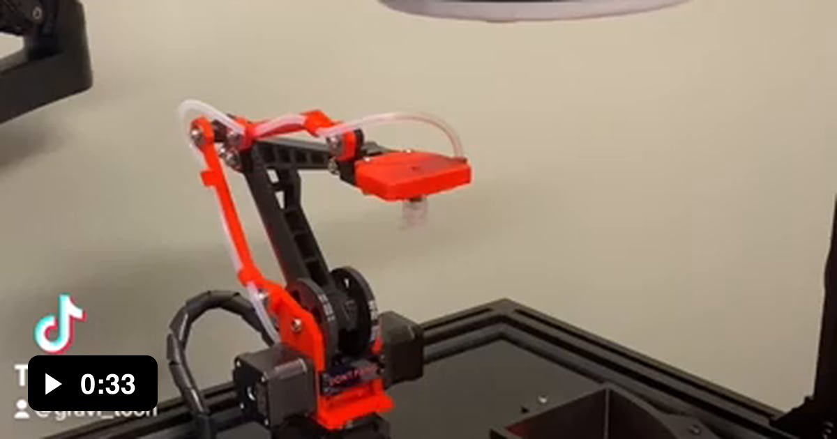 Three degrees of freedom pick and place robot arm that uses computer ...