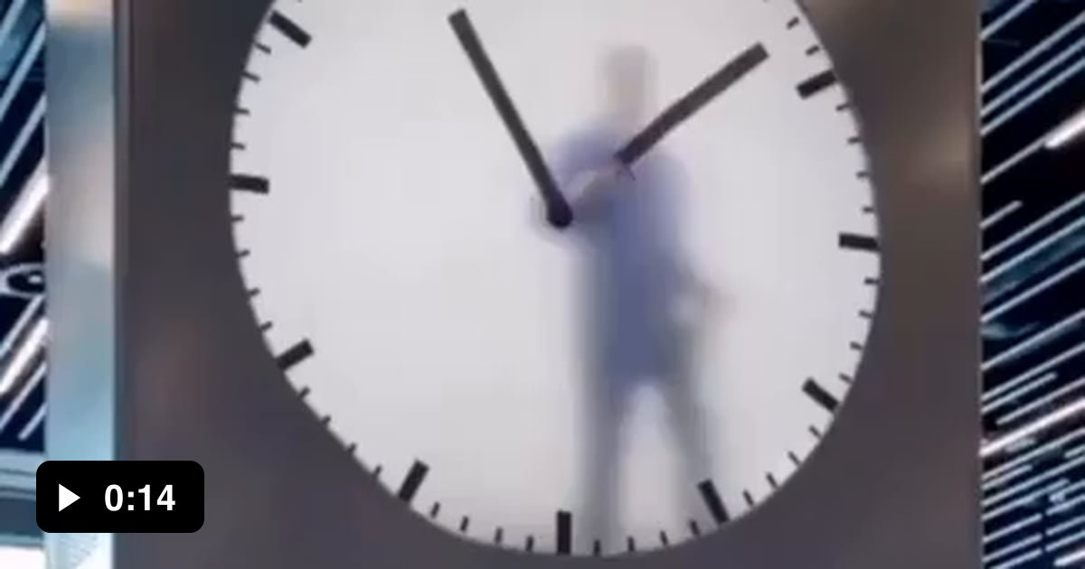 This clock at Amsterdam Schiphol Airport features a 12-hour video of a ...