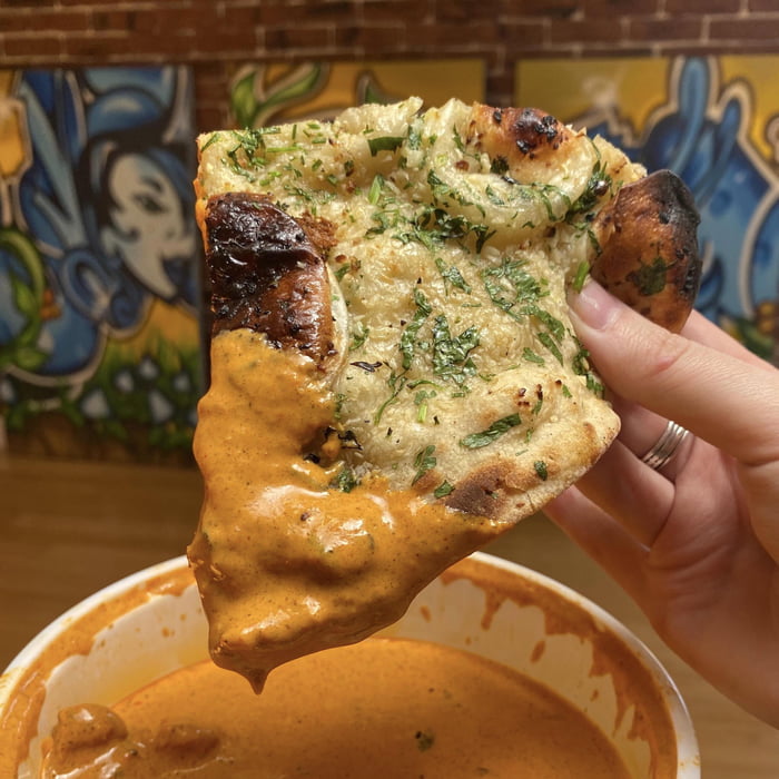 Garlic chili naan with extra spicy and creamy butter chicken - 9GAG