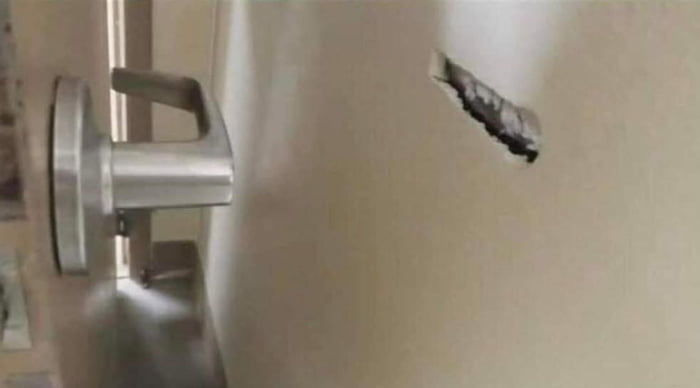 This door handle fits perfectly into this hole in the wall. - 9GAG