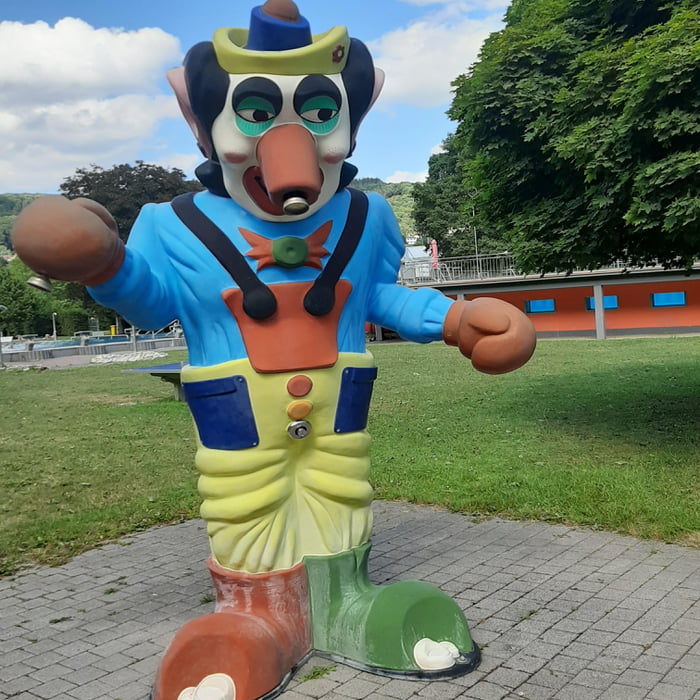 This clown shower for kids at a public pool with a happy button for ...