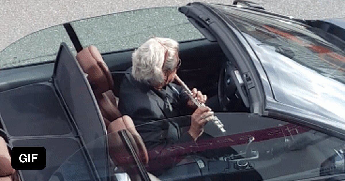 You might be cool, but your not as cool as this Granny driving a BMW while playing the Flute ...