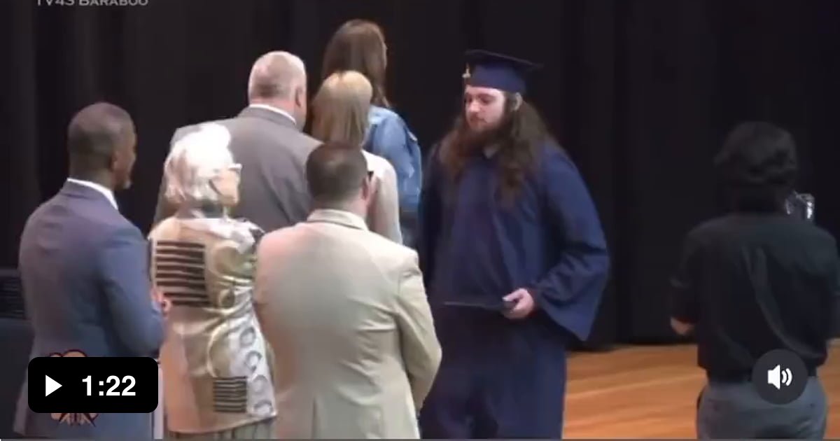 A father stops a black superintendent from shaking his daughter's hand during Baraboo High ...