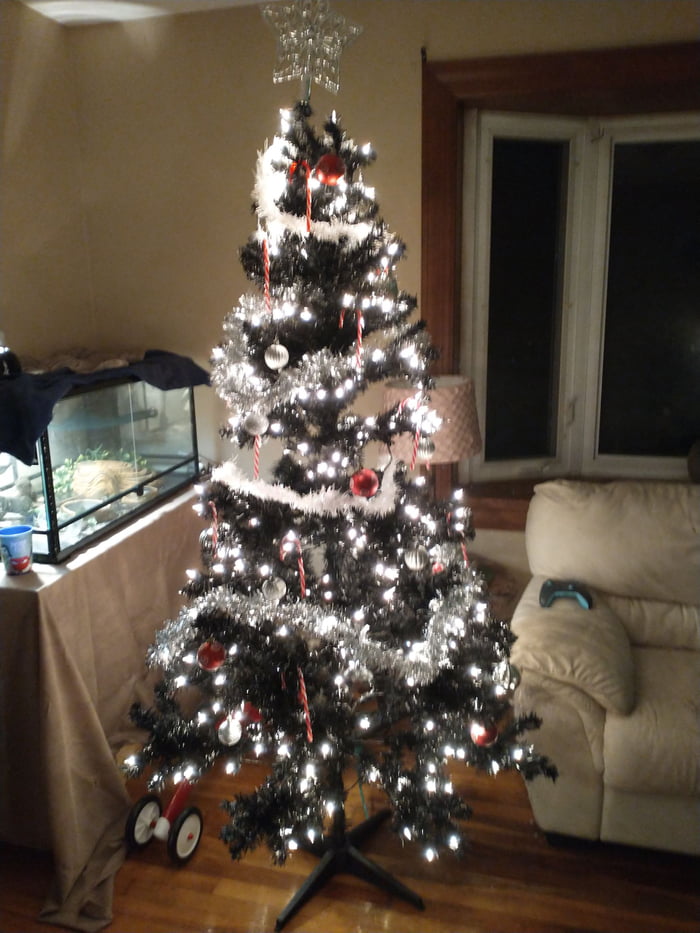 Simple black tree with silver and red ornaments. - 9GAG