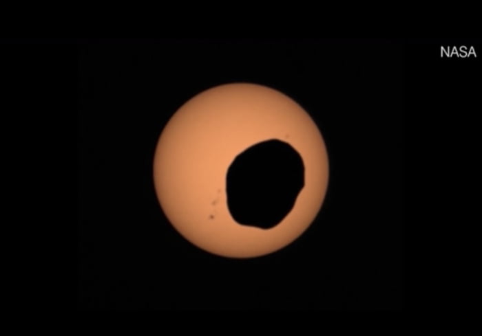 Solar Eclipse in Mars. Potato shaped moon. - 9GAG