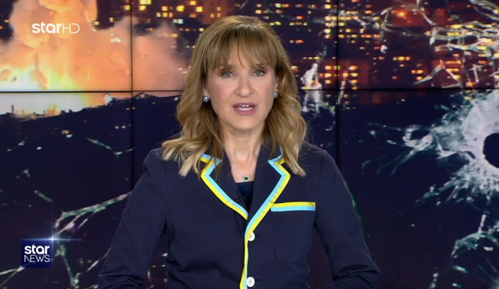 Greek Tv news anchor's clothes today "Slava Ukraini!" - 9GAG