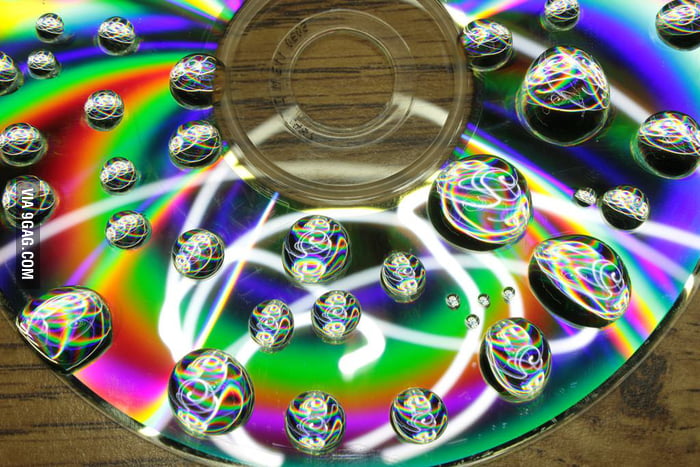 Taking a long exposure of waterdrops on a CD. - 9GAG