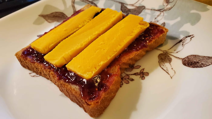 Wheat bread (non-toasted) raspberry jam, mild cheddar cheese. - 9GAG
