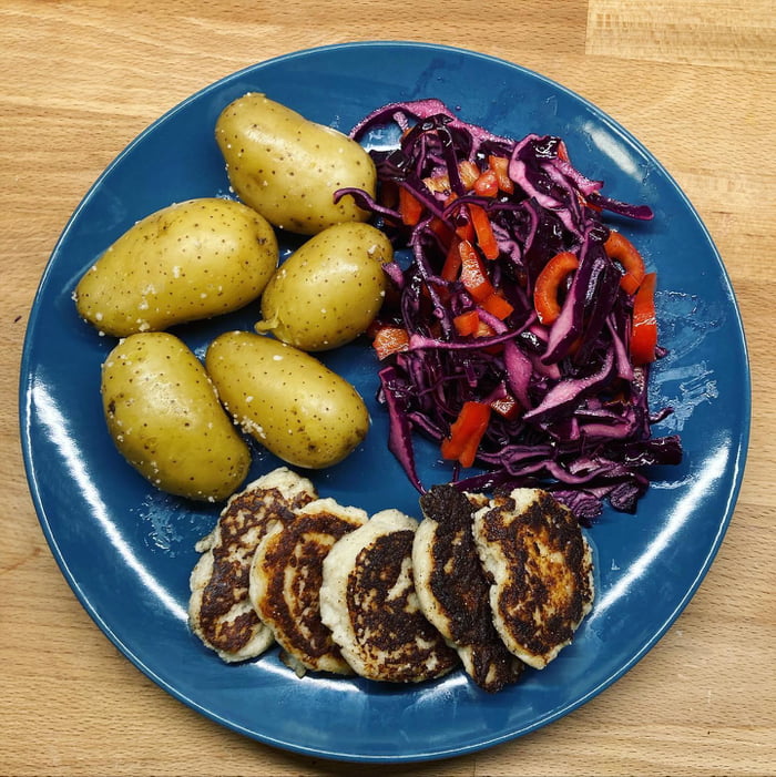 Danish fish cakes with potatoes and a red cabbage and red pepper salad ...