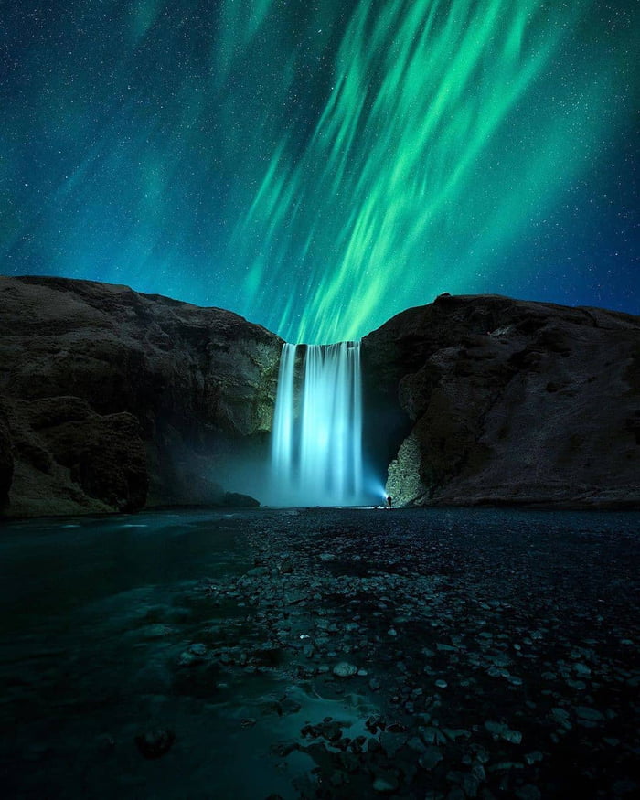 Aurora Borealis painted behind a glowing waterfall in Iceland - 9GAG