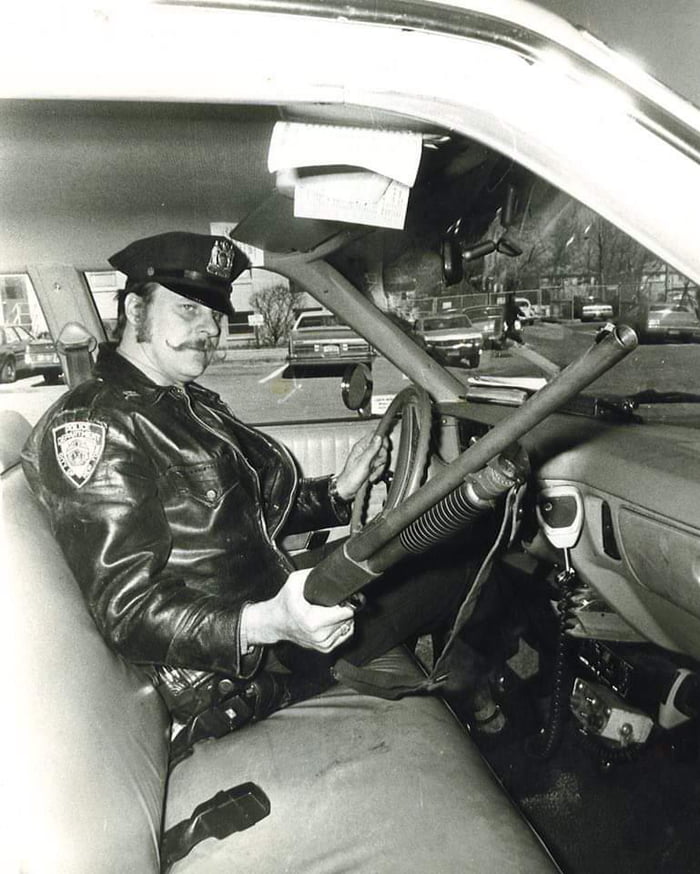 NYPD officer with moustache and shotgun, probably 1970s or early 1980s ...