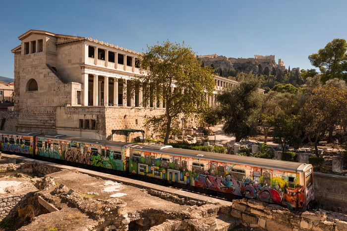 Athens Metro Line 1 rolling through the Roman Agora of ancient Athens ...
