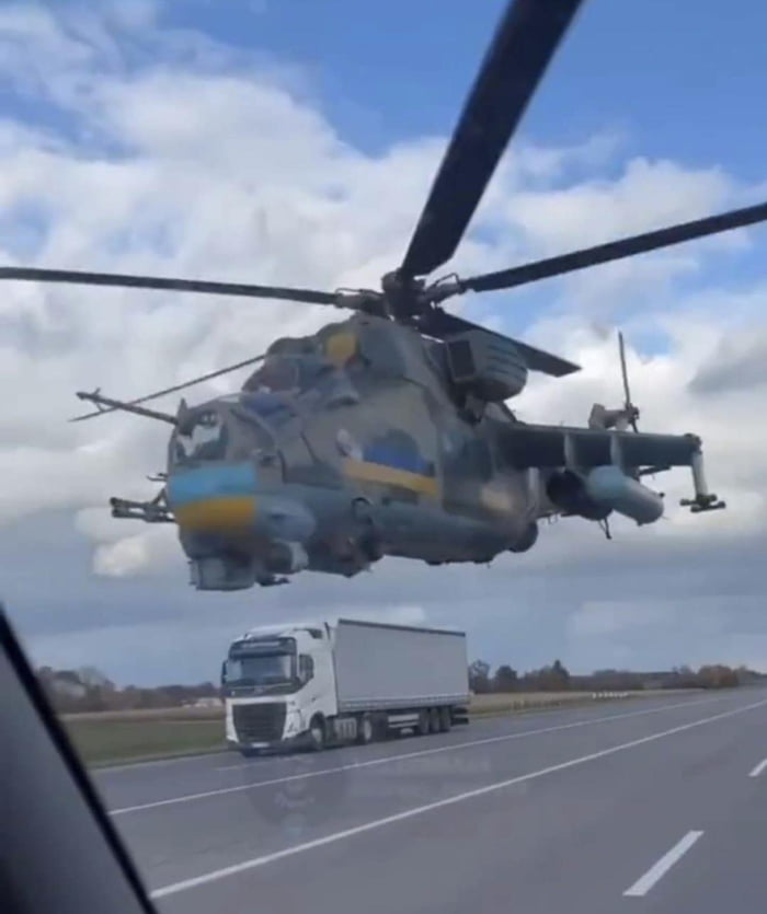 Ukrainian helicopter flying with freeway traffic to avoid Russian radar ...