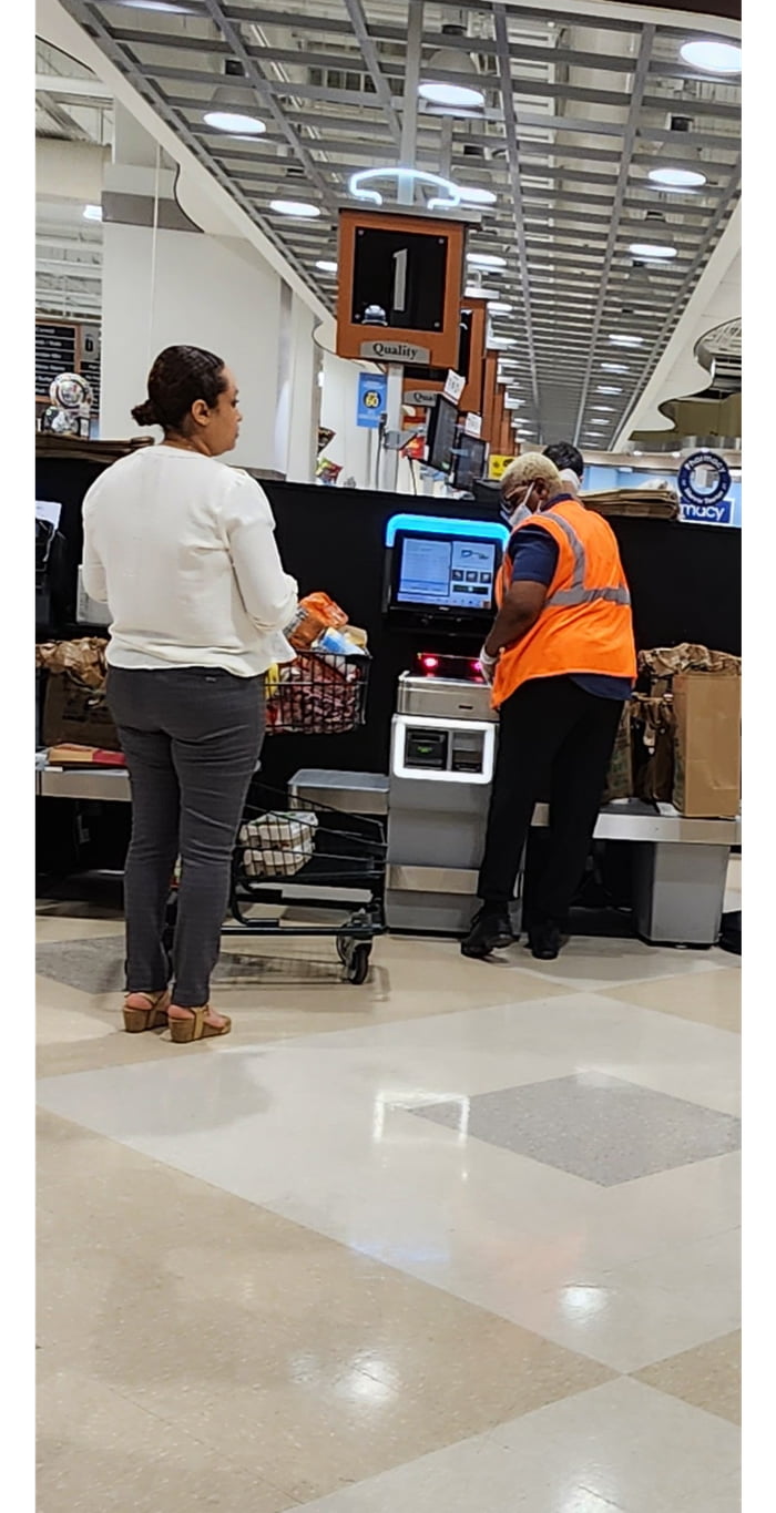 Lady goes to self checkout, makes attendant unload her cart, scan and ...
