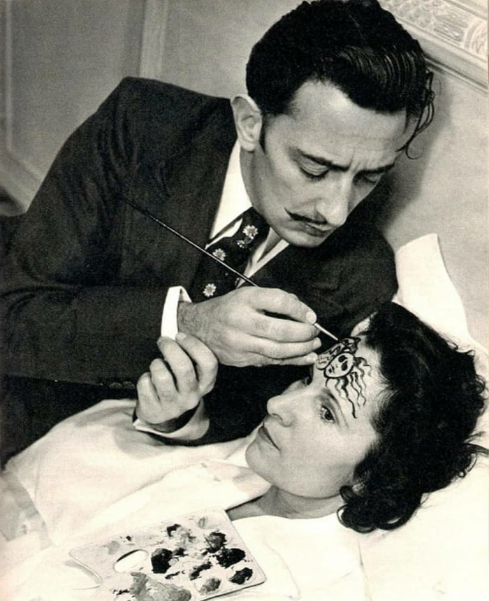 Salvador Dali painting on his wife's forehead. - 9GAG