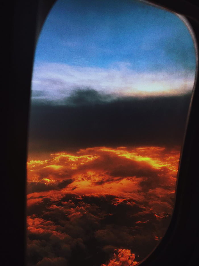 This pic from the airplane window looks like heaven and hell. - 9GAG
