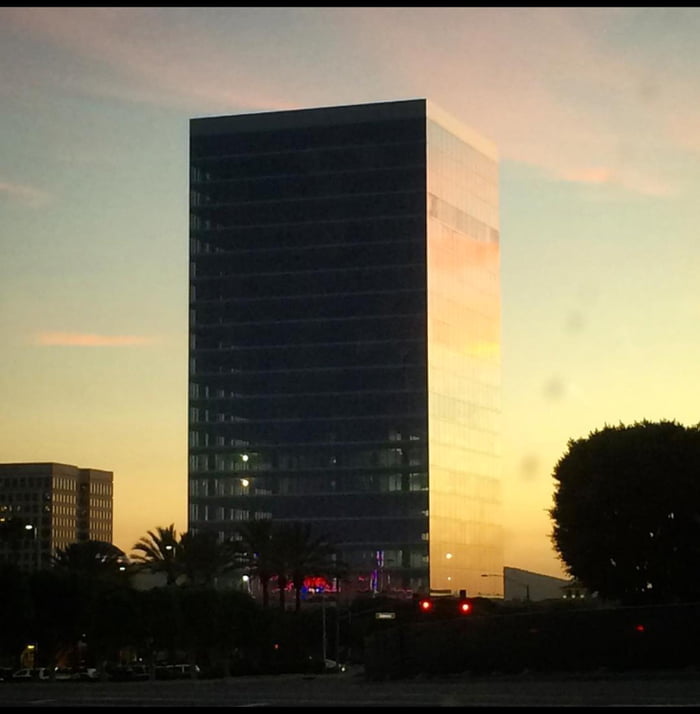 The way the side of this building reflects the sunset. - 9GAG