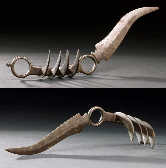 A bagh nakh (tiger claw weapon) with curved blade. India, 19th century ...