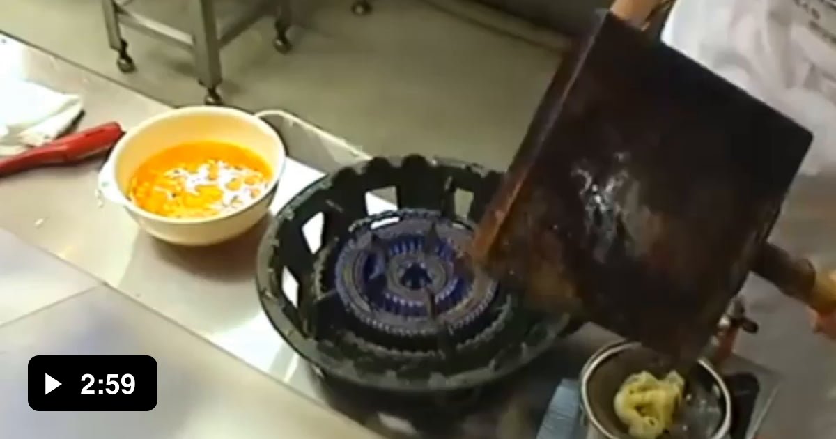 Japanese chef makes a very complicated omelette using a big tinned ...