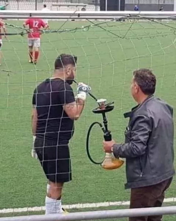 This goalkeeper smoking a hookah in the middle of a match - 9GAG