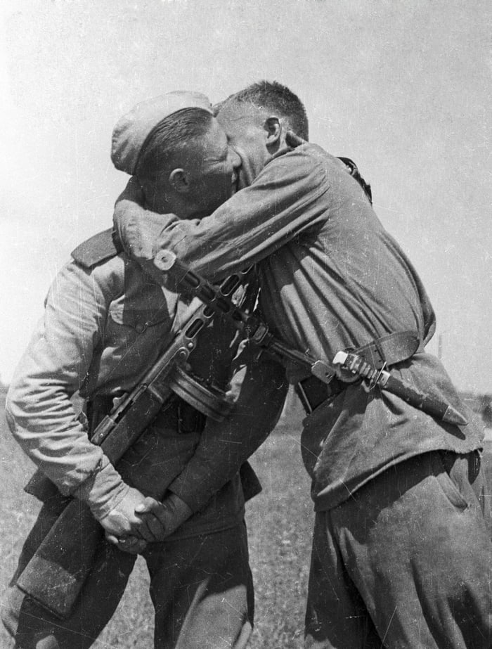 Soviet soldiers of the 3rd Ukrainian Front hug each other, following ...