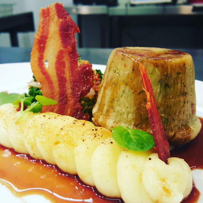 Comfit duck suet pudding, mash, bacon crisps, braised cabbage and duck ...