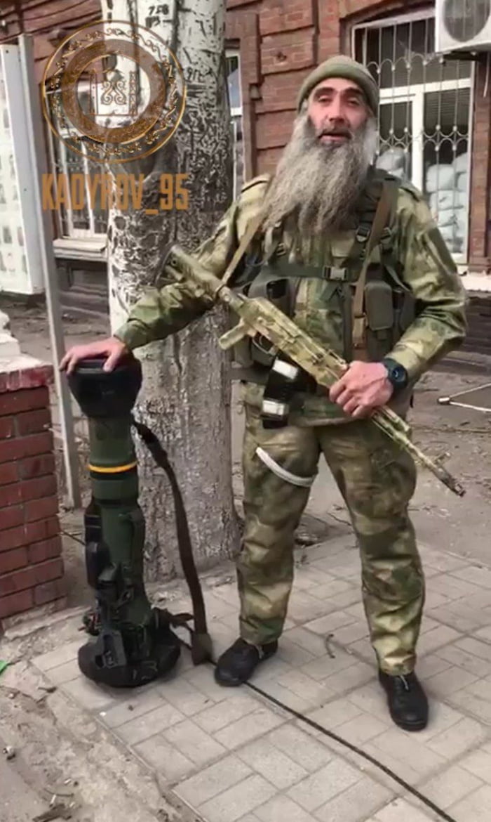 Chechen fighter with his trophy. - 9GAG