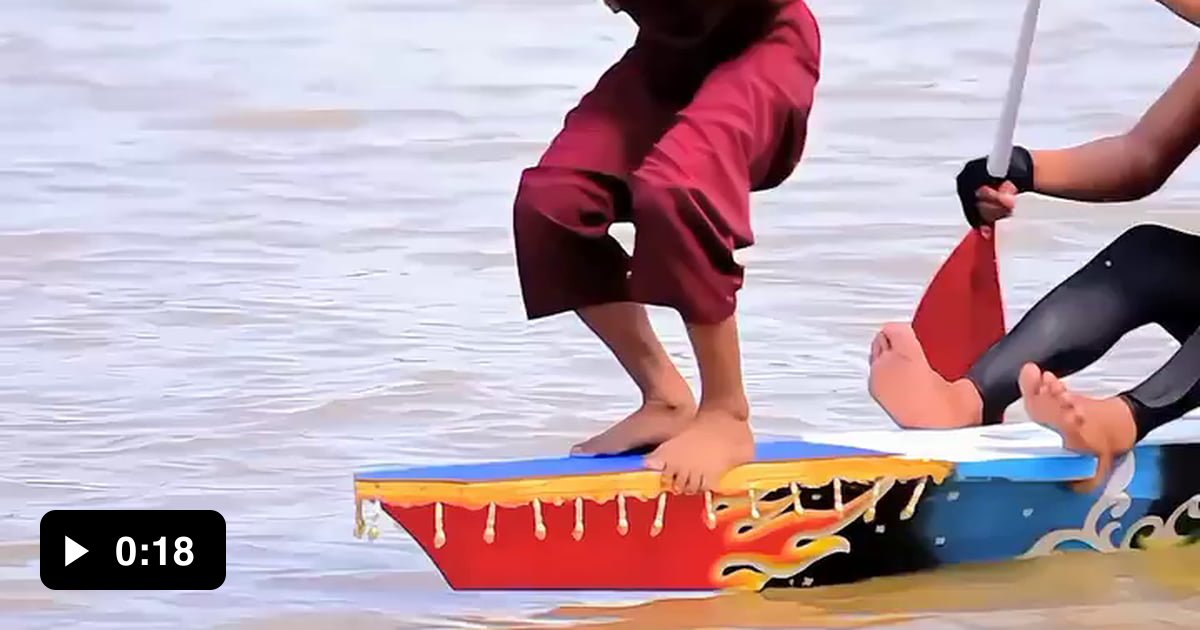 The boat race is getting intense, with the young boy leading the way ...