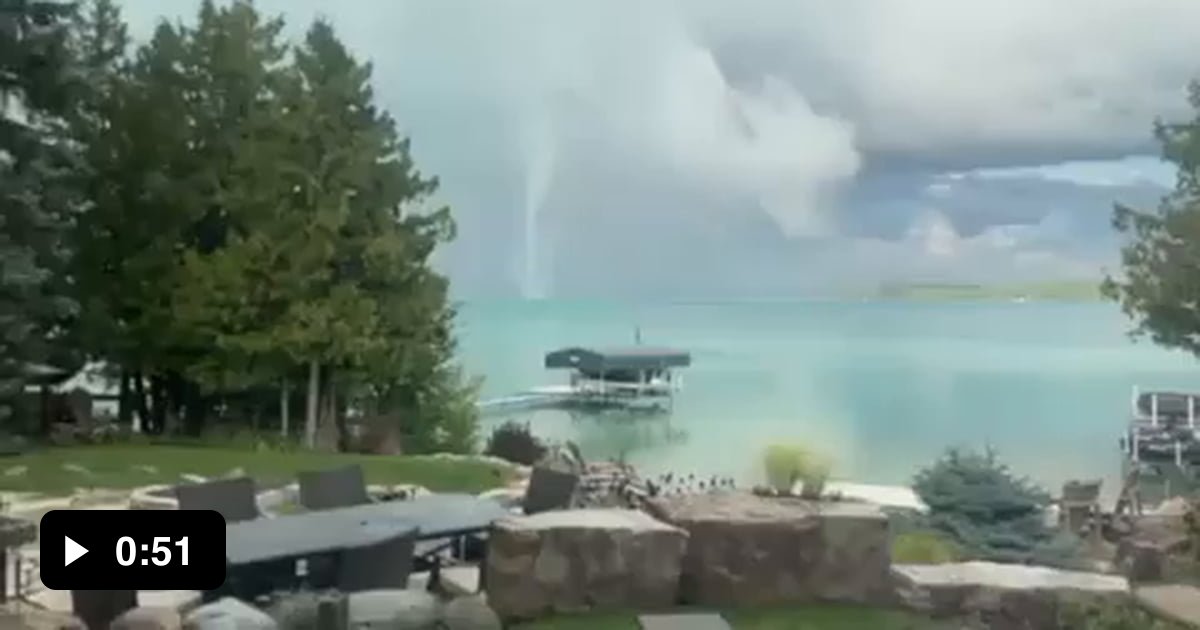 A waterspout gracefully dances across Torch Lake - 9GAG
