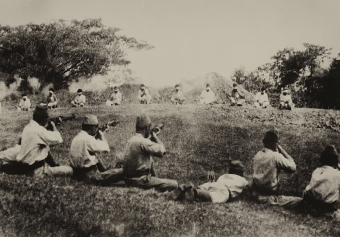 Japenese soldiers using captured POWs as target practice. 1942 - 9GAG