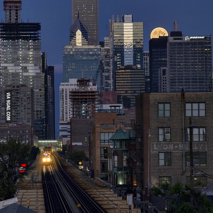 My view of the full moon rising behind Chicago last night - 9GAG