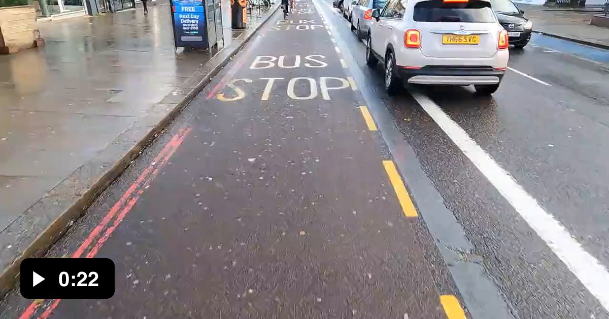 Car completes U-turn through bus lane and onto pavement in London. - 9GAG