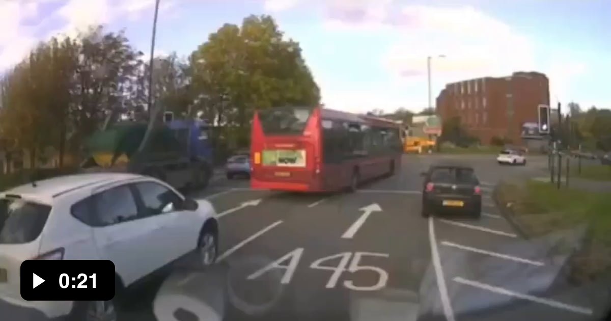 Wrong way on roundabout goes head-on into bus and walks away - 9GAG