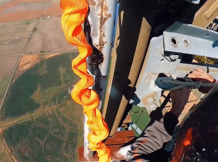 Tower Climber is working on a 2000ft tall guyed Mast. - 9GAG