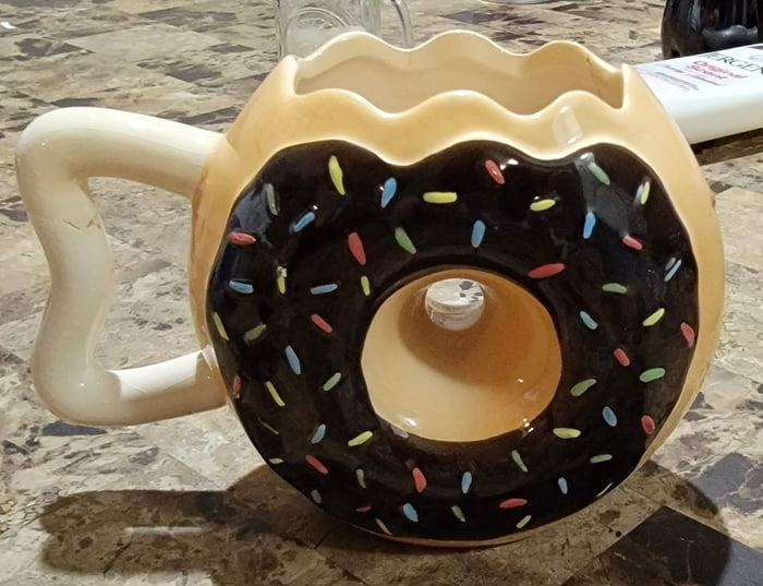 Visually a donut, literally a coffee mug, topologically neither... - 9GAG