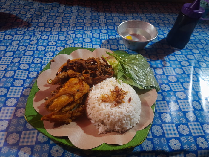 Fried chicken, fried intestine and uduk rice (steamed rice with coconut ...