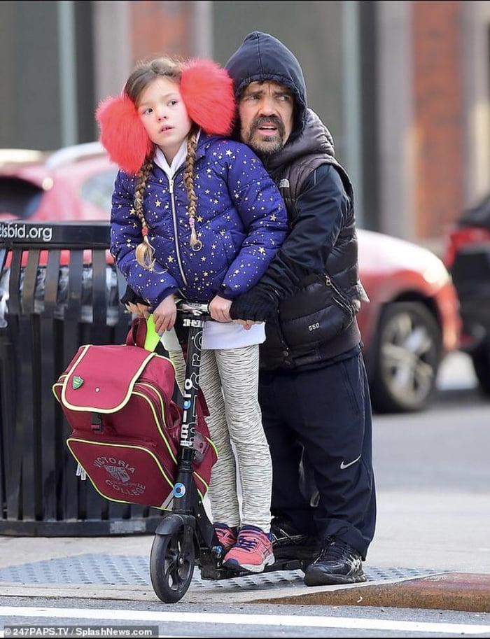 Peter Dinklage and his daughter on a scooter - 9GAG