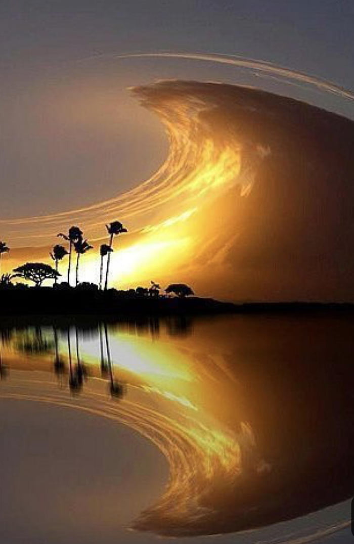 Amazing sunset inside a cloud, that looks like a tidal wave. And all ...