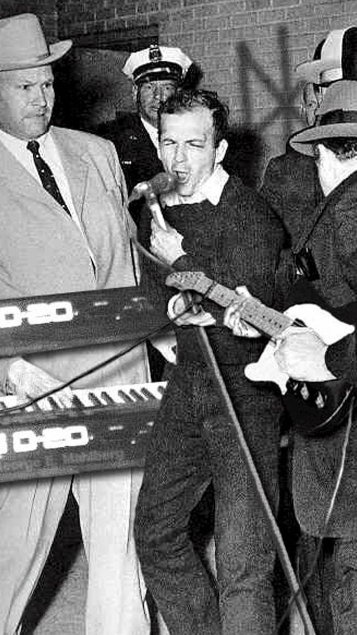 Nothing untoward in this photo at all. Just a nice rock band jamming ...